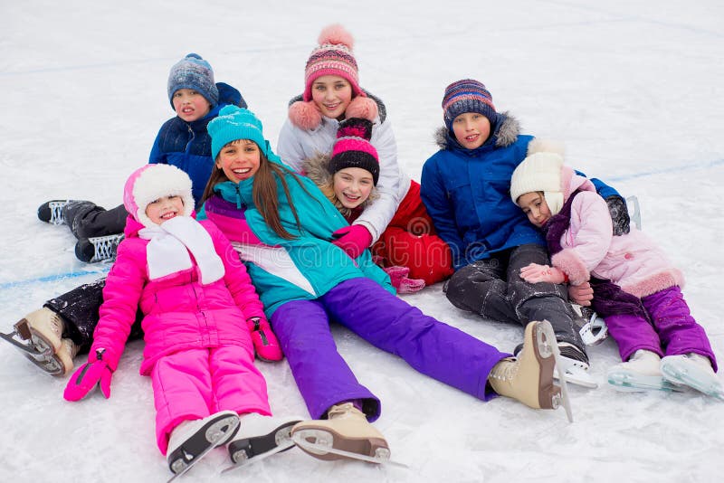 Group of Kids Sitting on the Ice Stock Image - Image of cheerful ...