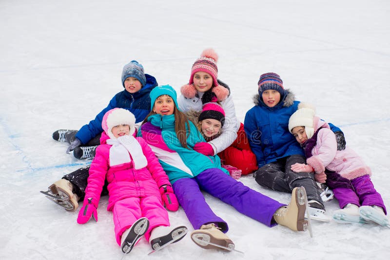 Group of Kids Sitting on the Ice Stock Image - Image of activity ...