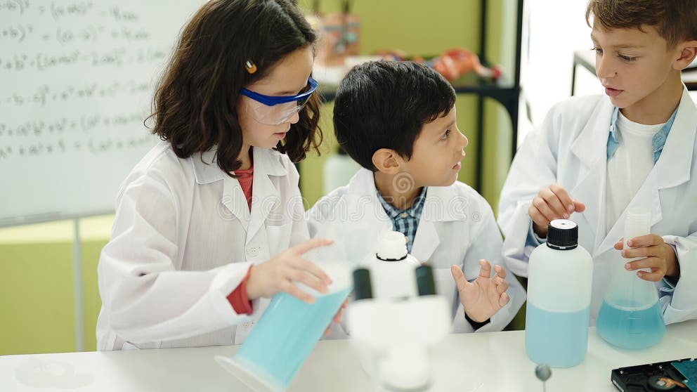 Group of Kids Students Pouring Liquid on Bottl Doing Experiment at ...