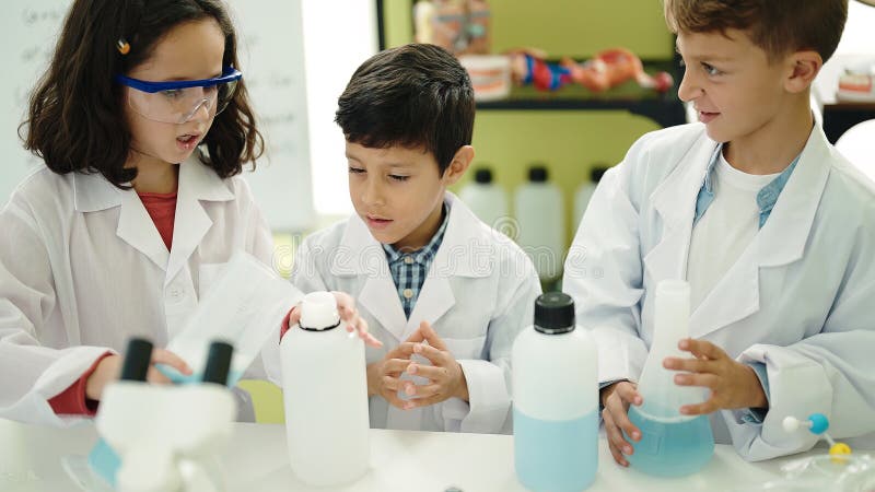 Group of Kids Students Pouring Liquid on Bottl Doing Experiment at ...