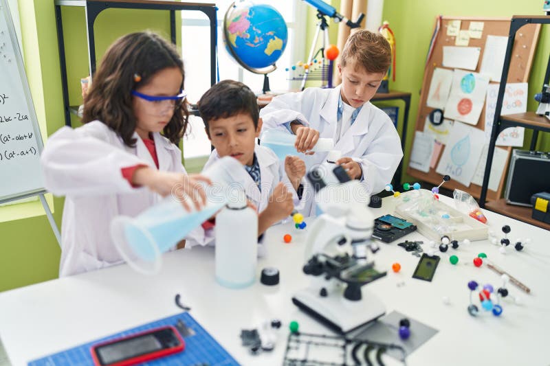 Group of Kids Students Pouring Liquid on Bottl Doing Experiment at ...