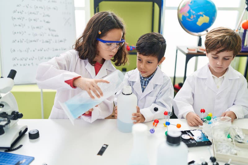 Group of Kids Students Pouring Liquid on Bottl Doing Experiment at ...