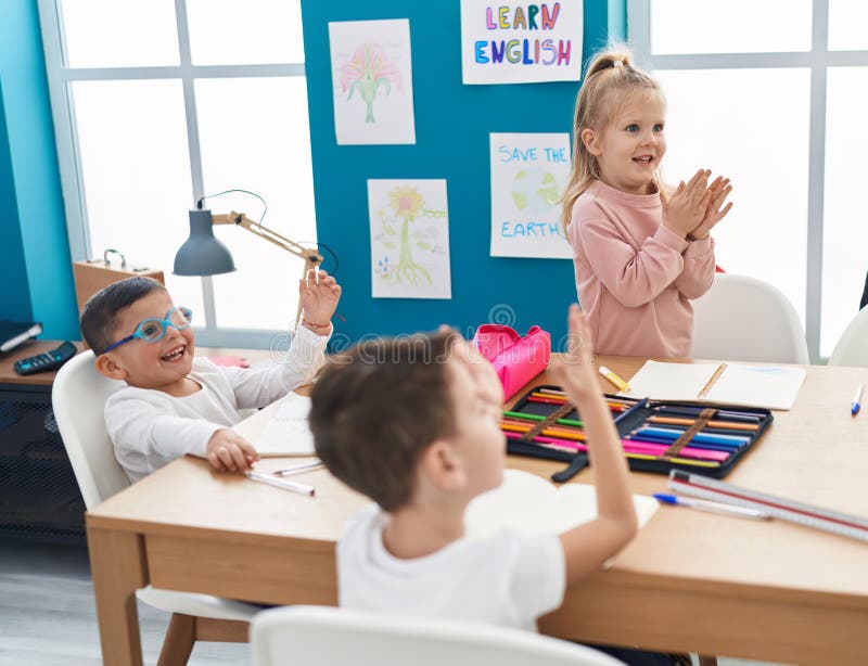 Group of Kids Students Sitting on Table Clapping Hands at Classroom ...