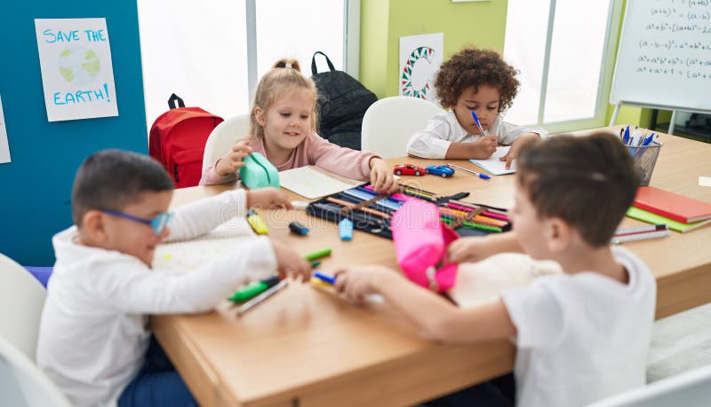 Group of Kids Students Sitting on Table Drawing on Notebook at ...