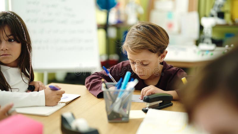 Group of Kids Students Sitting on Table Studying at Classroom Stock ...