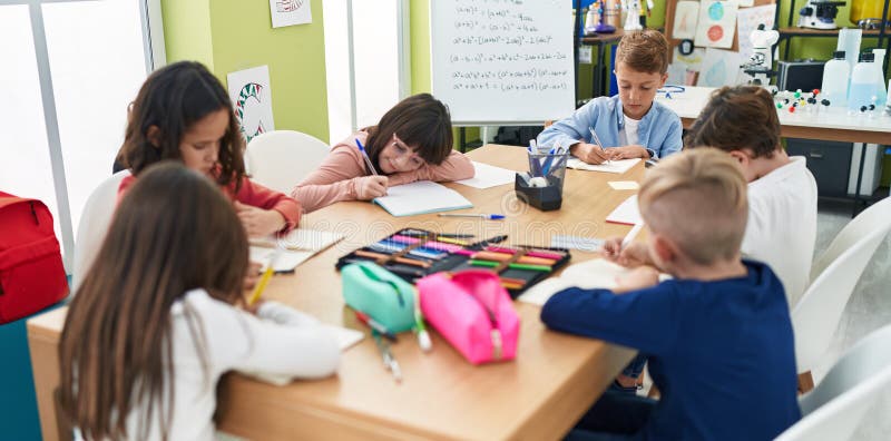 Group of Kids Students Sitting on Table Studying at Classroom Stock ...