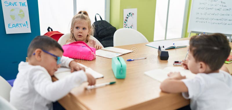 Group of Kids Students Sitting on Table Studying at Classroom Stock ...