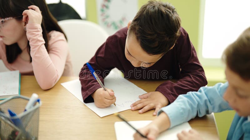 Group of Kids Students Sitting on Table Studying at Classroom Stock ...