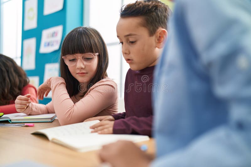 Group of Kids Students Sitting on Table Studying at Classroom Stock ... Group of Kids Students Sitting on Table Studying at Classroom Stock ...