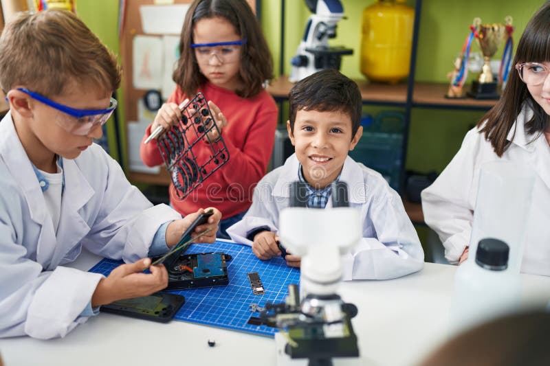 Group of Kids Students Using Microscope Repairing Gadget at Laboratory ...