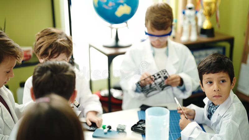 Group of Kids Students Using Microscope Repairing Gadget at Laboratory ...