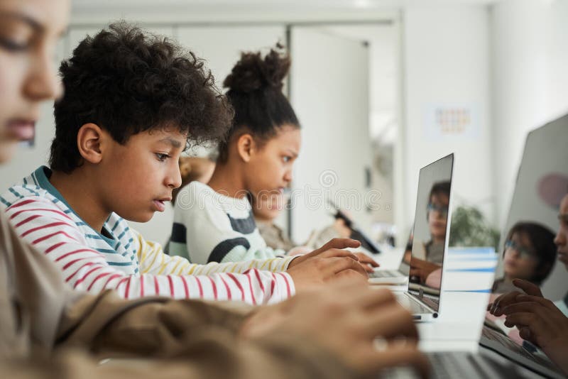 Group of Teen School Children Using Computers in Classroom Stock Image ...