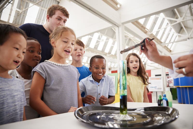 Group of Kids and Teachers Carrying Out a Science Experiment Stock ...