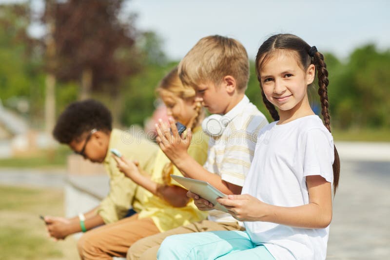 Group of Kids Using Gadgets Outdoors Stock Photo - Image of outdoors ...