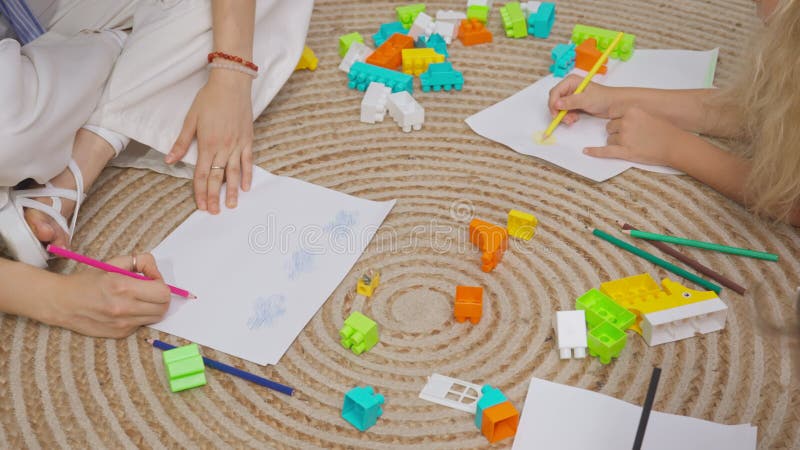 Group of Children Sitting on the Floor and Playing Toy Constructor in ...