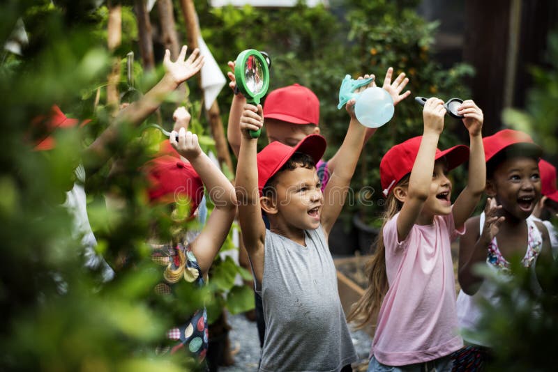Group of Kindergarten Kids Learning Gardening Outdoors Stock Photo ...