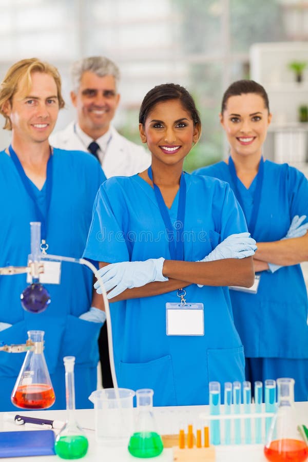 Group lab technicians stock image. Image of handsome - 32451793