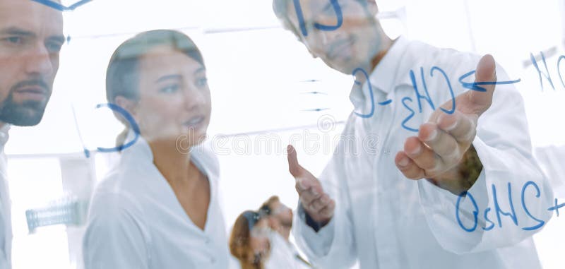Group of Laboratory Scientists Discussing Their Research in the Stock ...