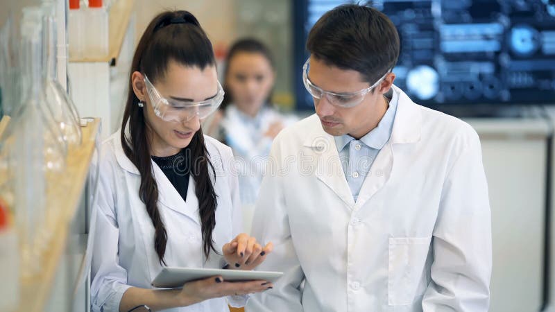 Group of Laboratory Scientists Discussing Their Research at the Lab ...