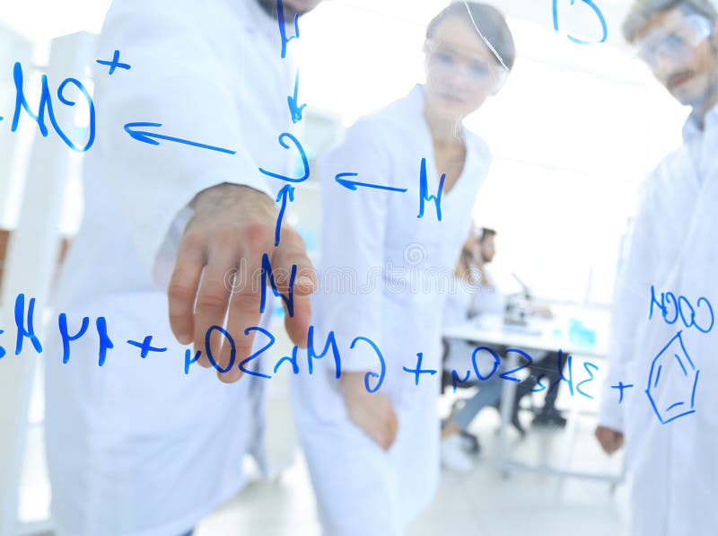 Group of Laboratory Scientists Discussing Their Research in the ...