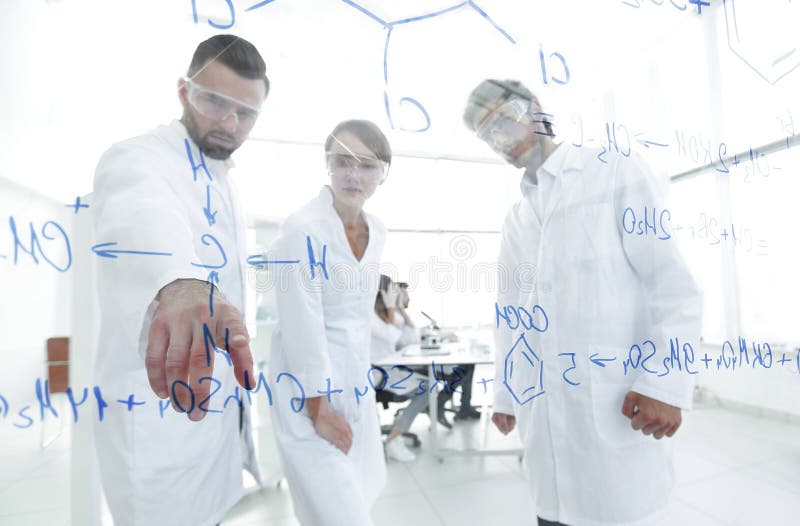 Group of Laboratory Scientists Discussing Their Research in the ...