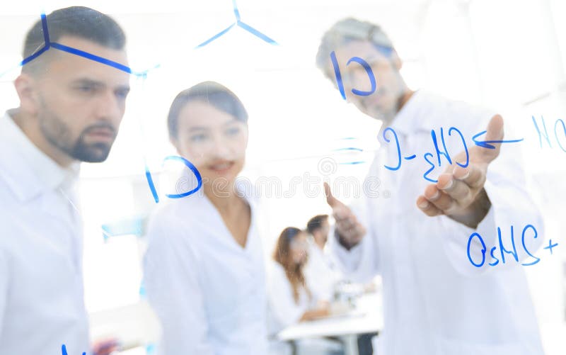 Group of Laboratory Scientists Discussing Their Research in the ...