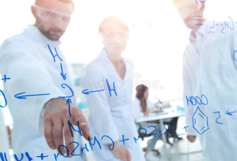 Group of Laboratory Scientists Discussing Their Research in the ...