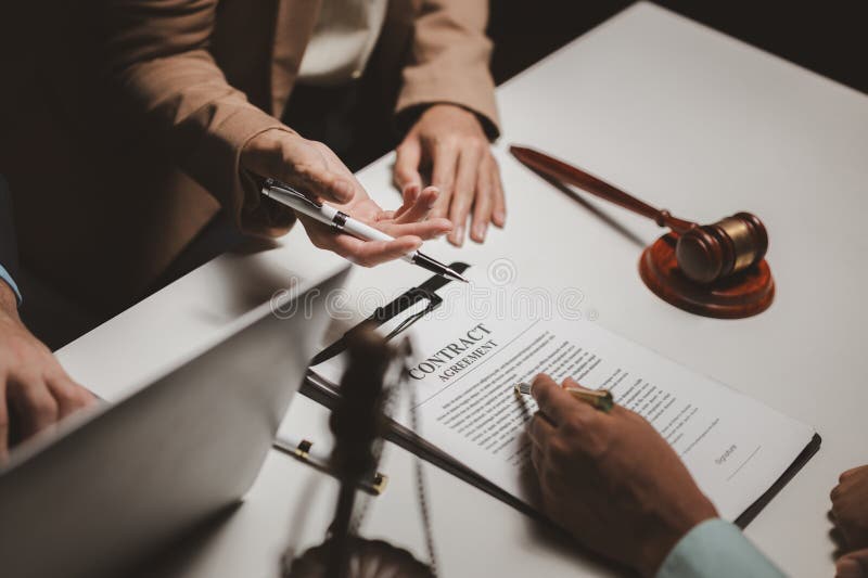 A Group of Lawyers and Clients are Discussing the Contract they Will Be ...