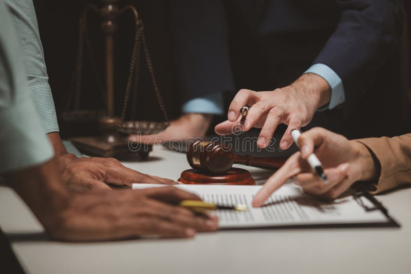 A Group of Lawyers and Clients are Discussing the Contract they Will Be ...