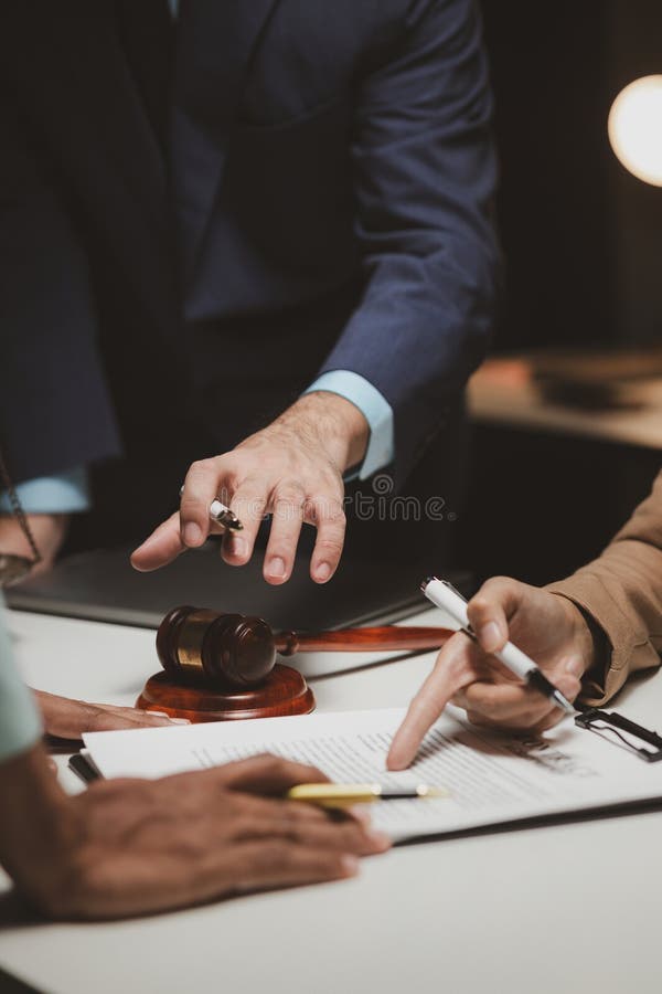 A Group of Lawyers and Clients are Discussing the Contract they Will Be ...