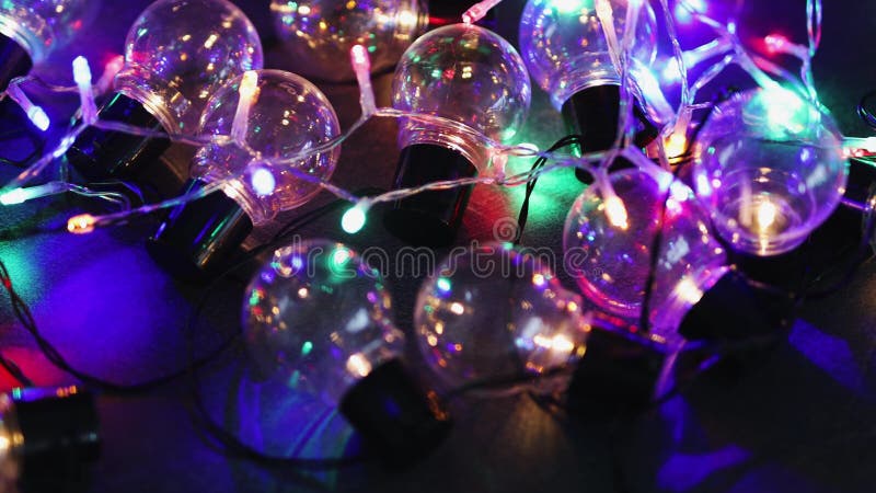 Group of Lightbulb Shaped String Lights Shining on Dark Desk with ...