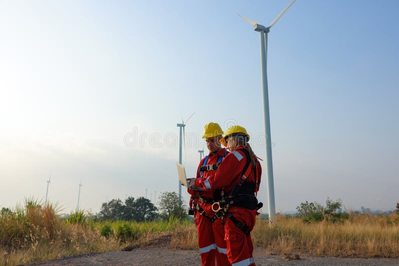 Group of Maintenance Workers and Electric Engineer Looking at Wind ...
