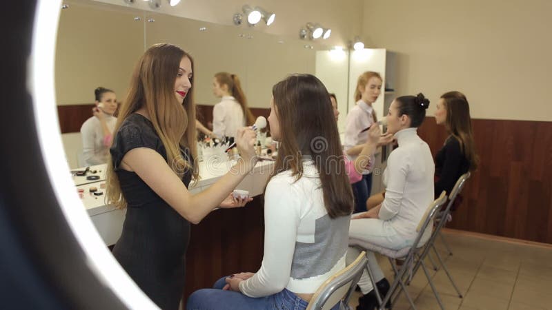 Make-up Artists Doing Make-up for Three Girls. Stock Footage - Video of ...