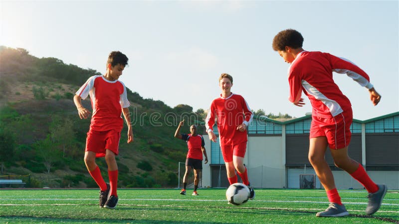 Group of Male High School Students with Coach Playing in Soccer Team ...
