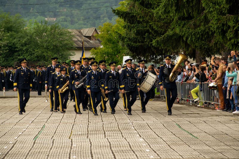Group of Male Musicians in Military Uniforms Playing Large Instruments ...