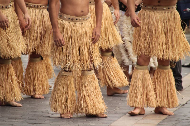 Men in Traditional Grass Skirts Performing a Dance. Stock Image - Image ...