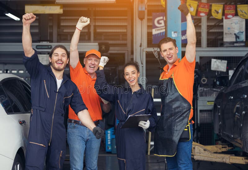 Group of Mechanic Workers is Cheerful with Finished Repair Work at Car ...