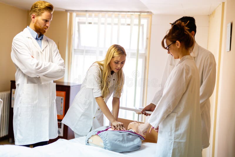 Group of Medical Students Practicing Reanimation Task on Model Stock ...