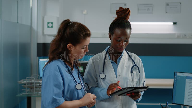 Group of Medical Workers Using Tablet for Consultation Stock Photo ...
