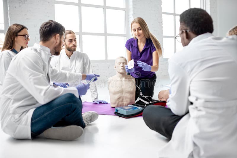 Group of Medics during the First Aid Training Indoors Stock Photo ...