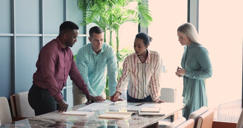 Group Meeting of Millennial Diverse Teammates Do Paperwork Stock Video ...