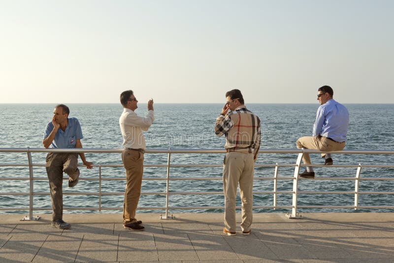 A group of men, Beirut editorial photography. Image of waterfront ...