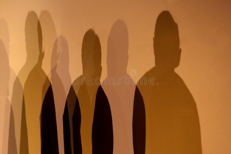 Men Cast Shadows on a Wall stock photo. Image of abstract - 252759640