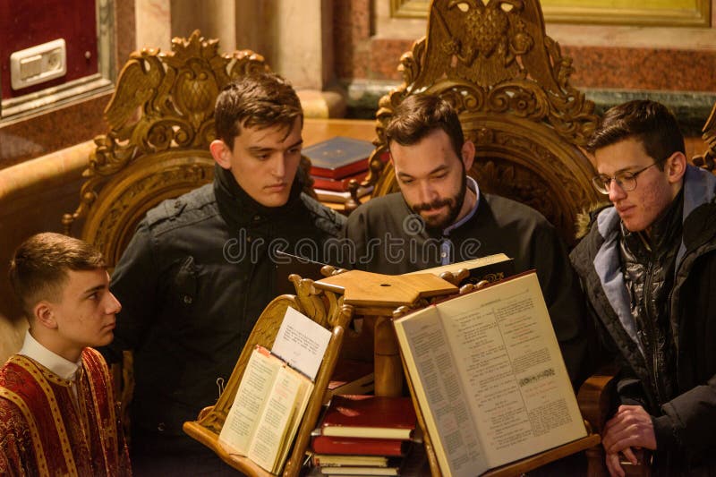A Group of Men in a Church Observing the Bible Standing by Its Sides ...