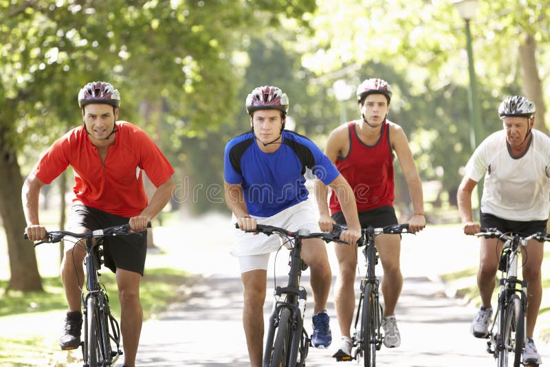 Group of Men on Cycle Ride through Park Stock Photo - Image of outdoors ...