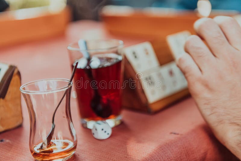 A Group of Men Drink Traditional Turkish Tea and Play a Turkish Game ...
