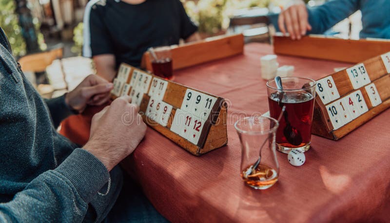 A Group of Men Drink Traditional Turkish Tea and Play a Turkish Game ...