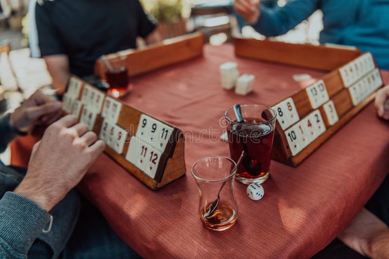 A Group of Men Drink Traditional Turkish Tea and Play a Turkish Game ...