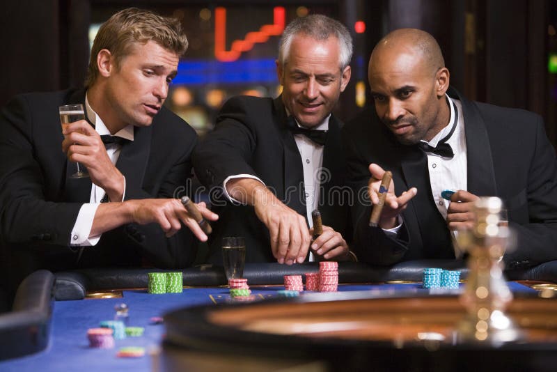 Group of Men Gambling at Roulette Table Stock Image - Image of ...