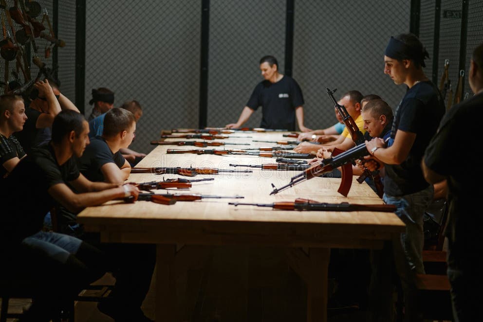 Group of Men Sitting at a Table with Automatic Assault Rifles Editorial ...